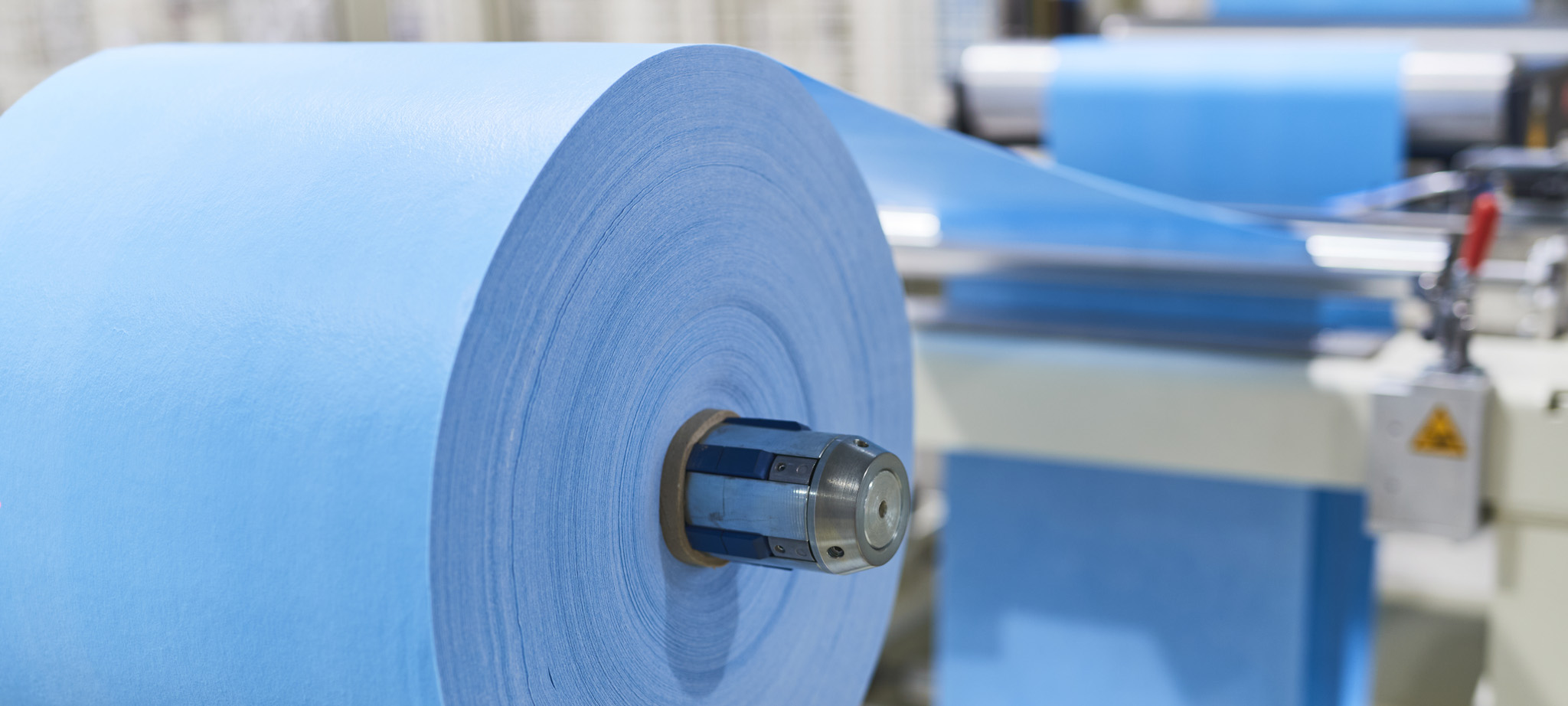 Machines for the automated processing of roll goods for all application ...